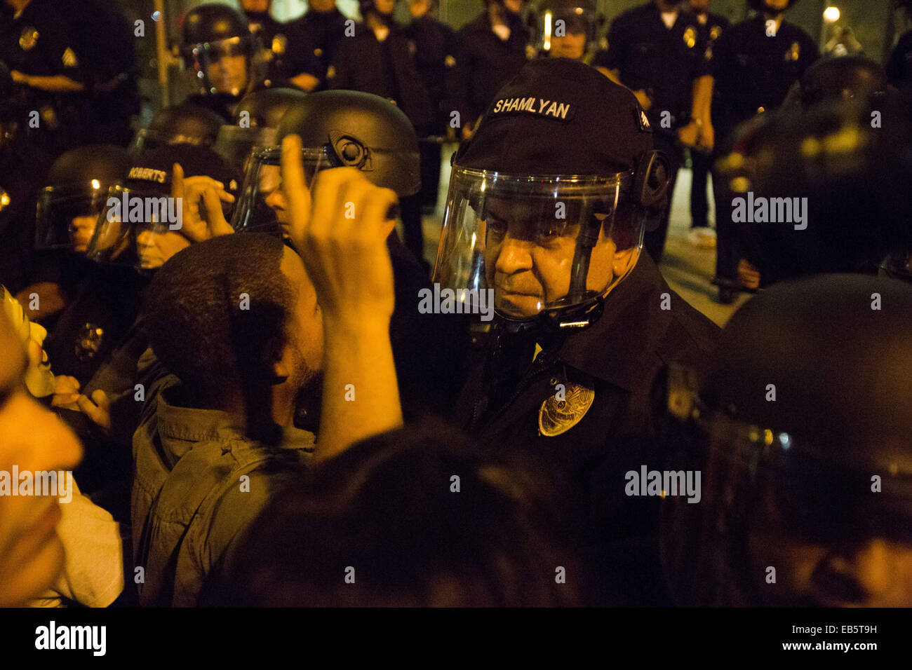 Los Angeles, California, USA. 25th Nov, 2014. Police officers confront ...