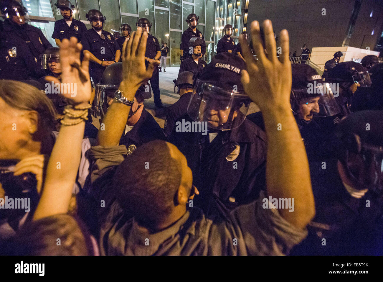 Los Angeles, California, USA. 25th Nov, 2014. Police officers confront ...