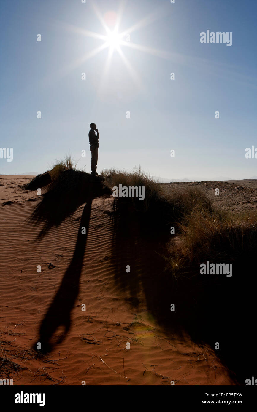 Man with long shadow in Wolwedans Landscape - NamibRand Nature Reserve ...