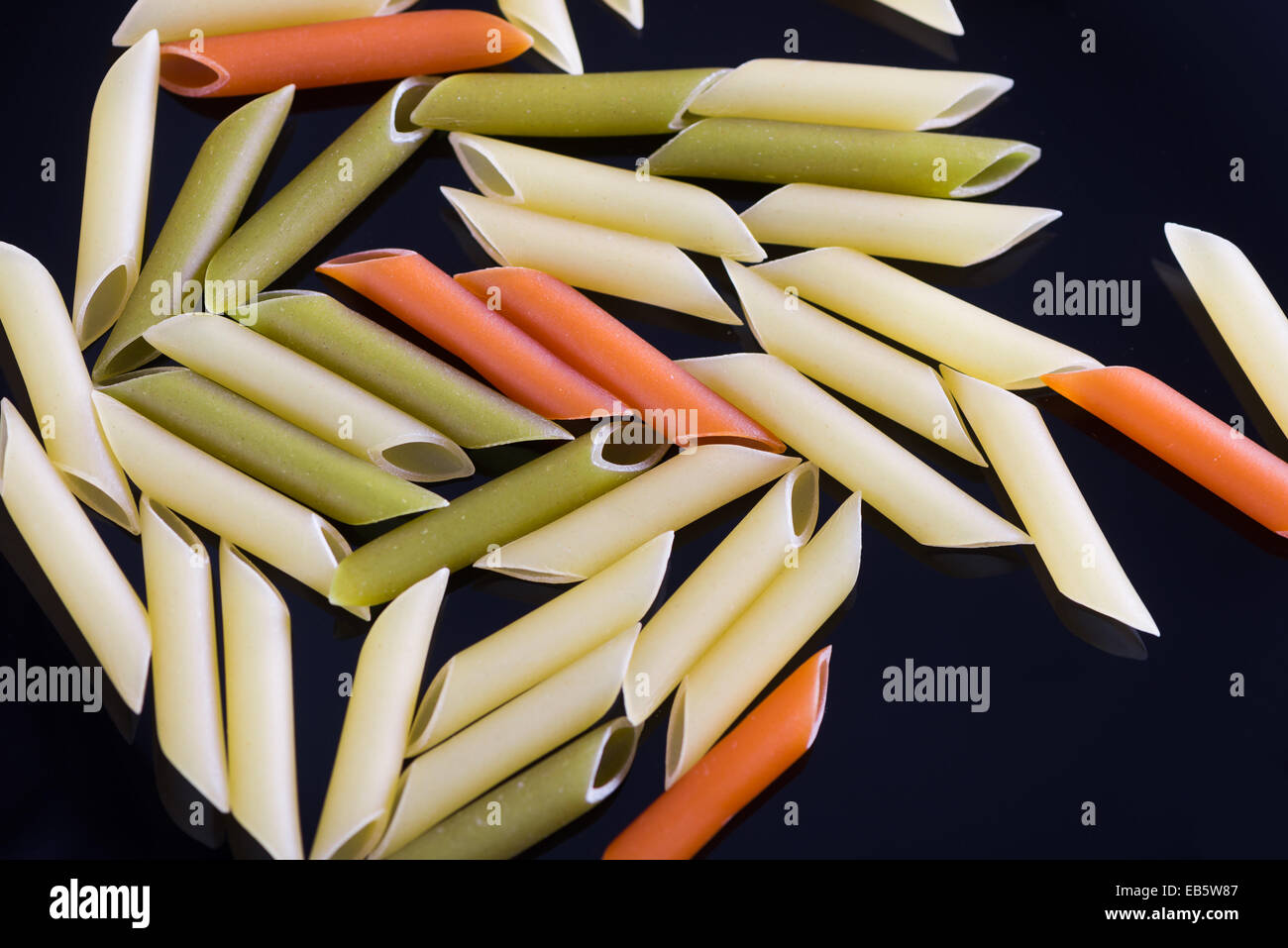 Italian pasta color - green, white and red - Penne lisce Stock Photo ...