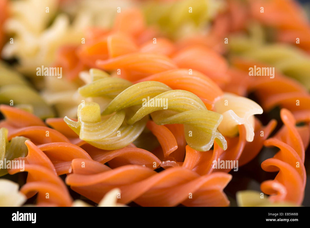 Italian pasta color - green, white and red - fusilli Stock Photo - Alamy
