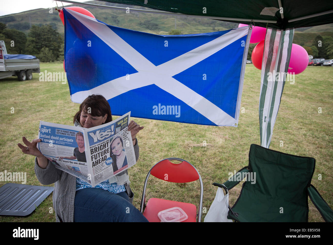 A woman reading a pro-independence newspaper at a stall at the Dalmally ...