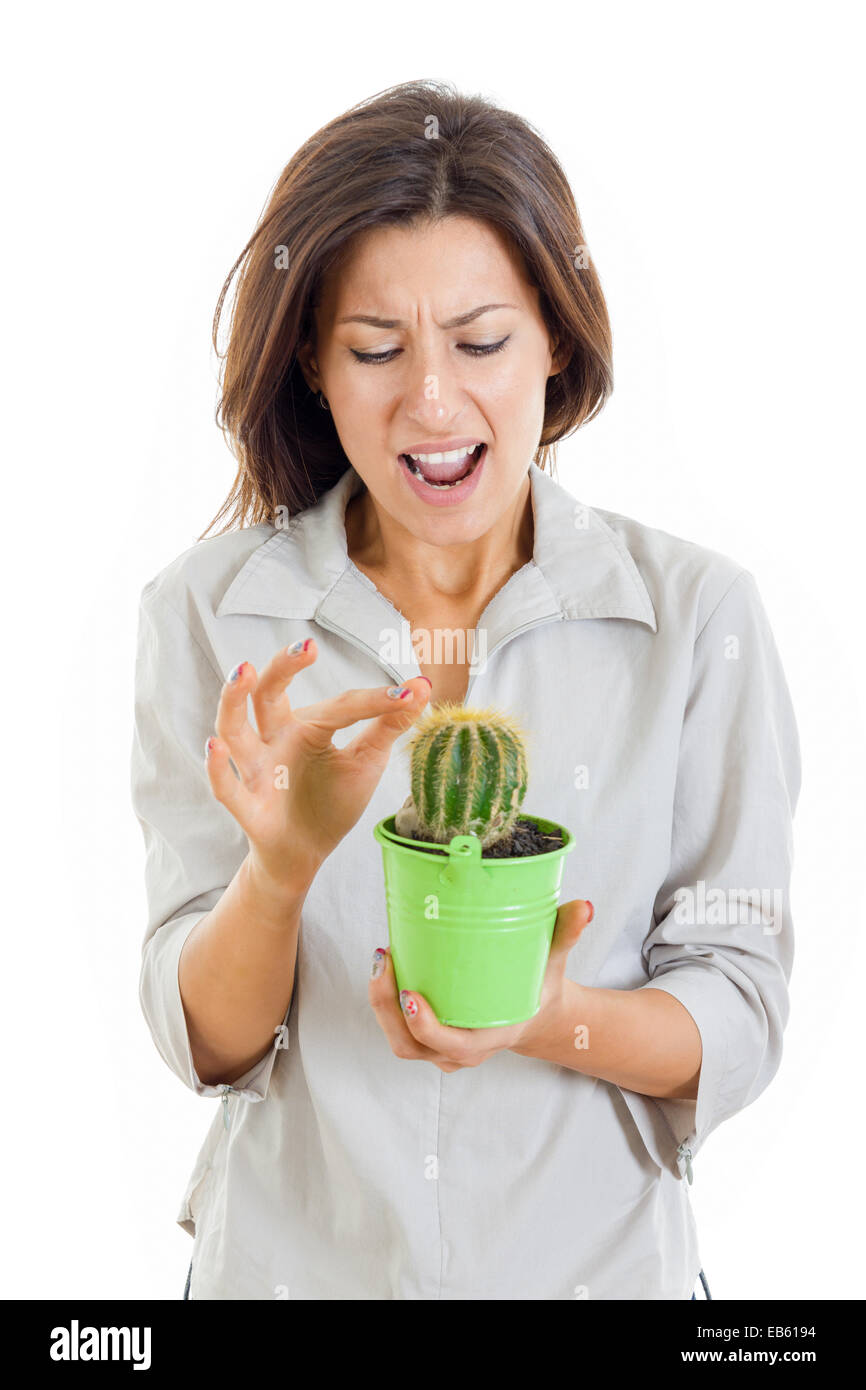 woman holding cactus plant and stabbed her finger with painful facial ...