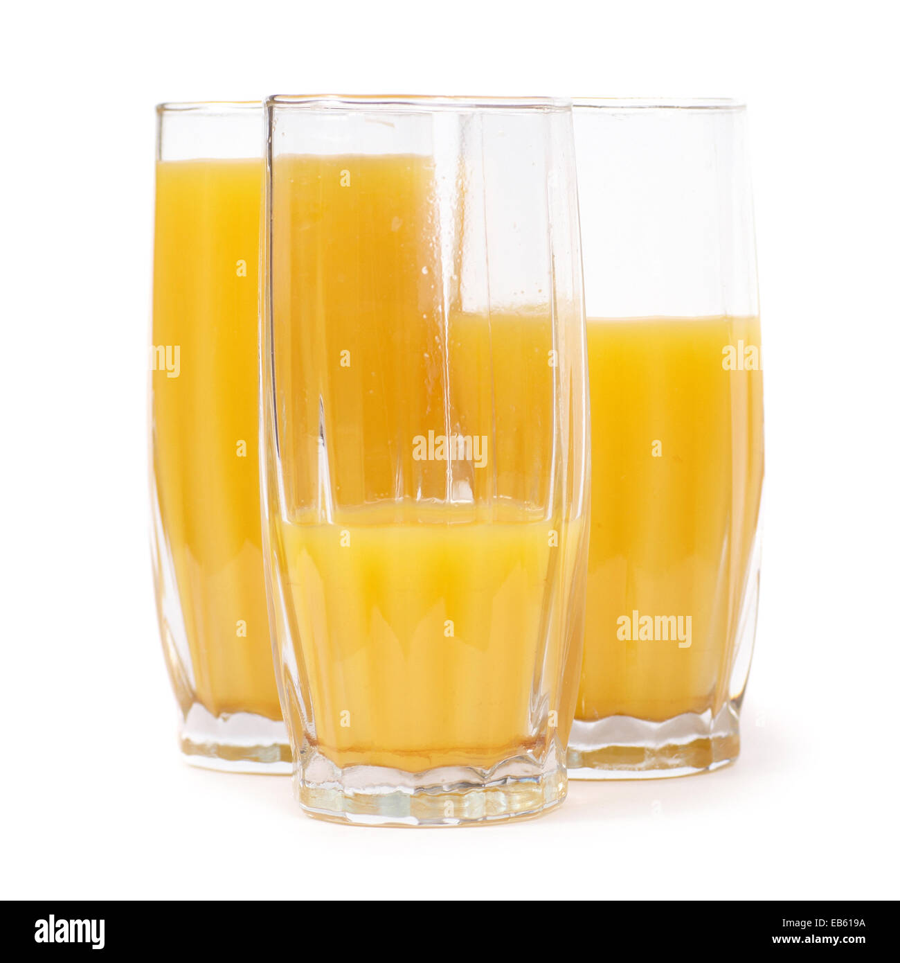 Three glasses with orange juice isolated on white Stock Photo - Alamy