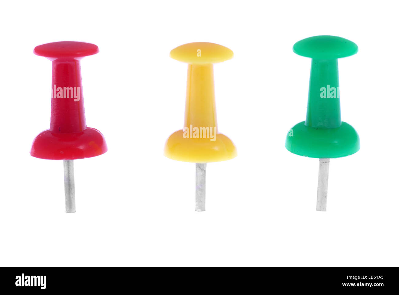 Three colored pins isolated on white background Stock Photo - Alamy