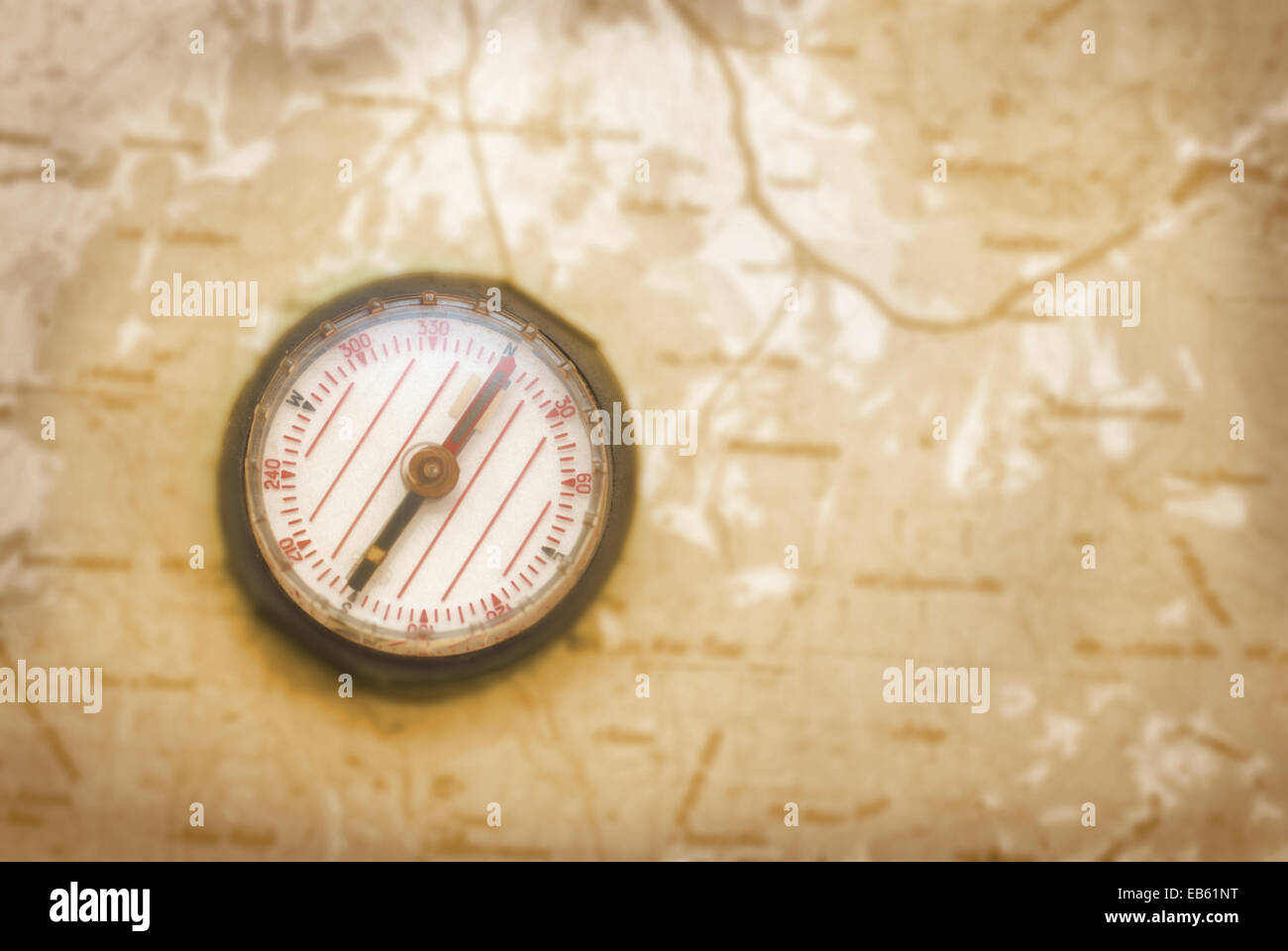 Compass over the old map- concept background Stock Photo - Alamy