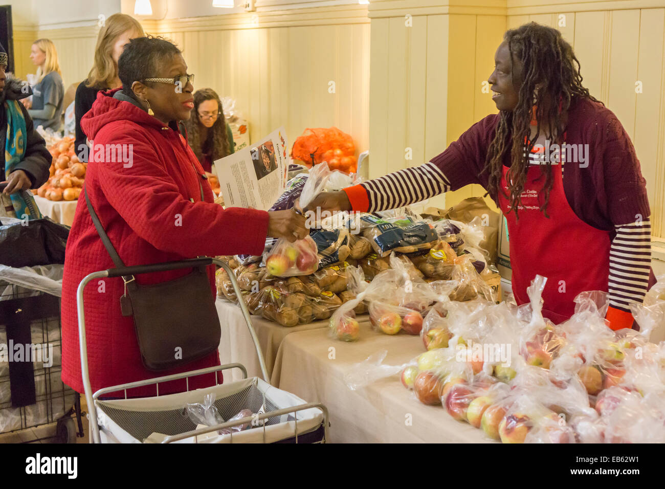 Volunteers distribute turkeys, stuffing and all the other "fixin's" for ...