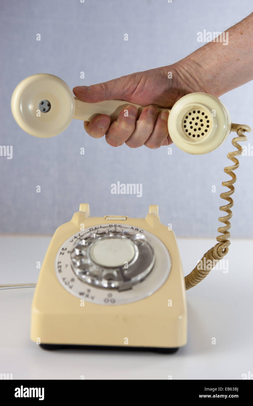 Answering an old fashioned rotary dial telephone Stock Photo - Alamy