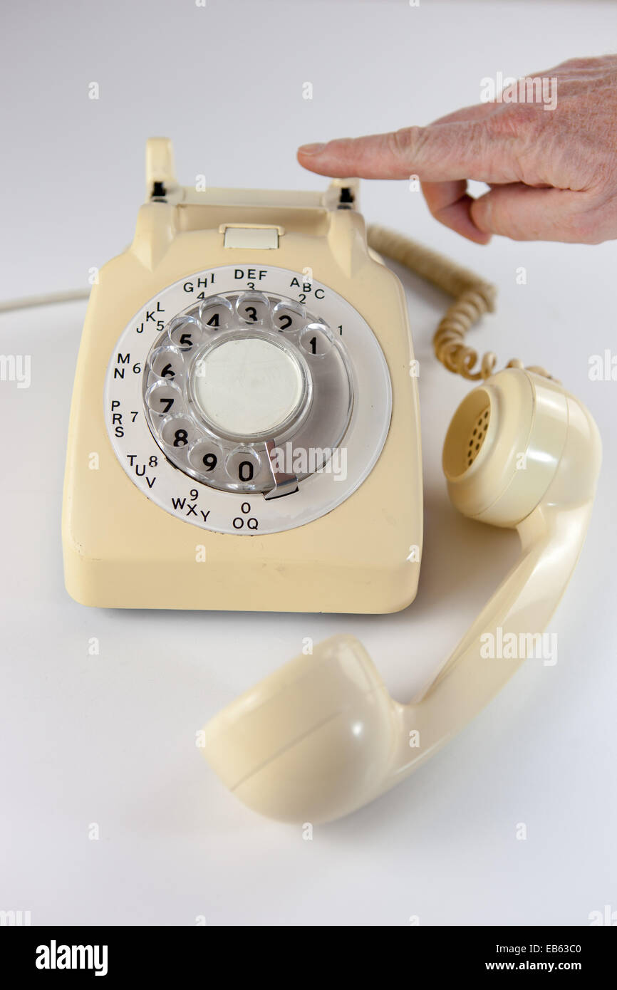 Hanging up a call on an old fashioned telephone Stock Photo - Alamy