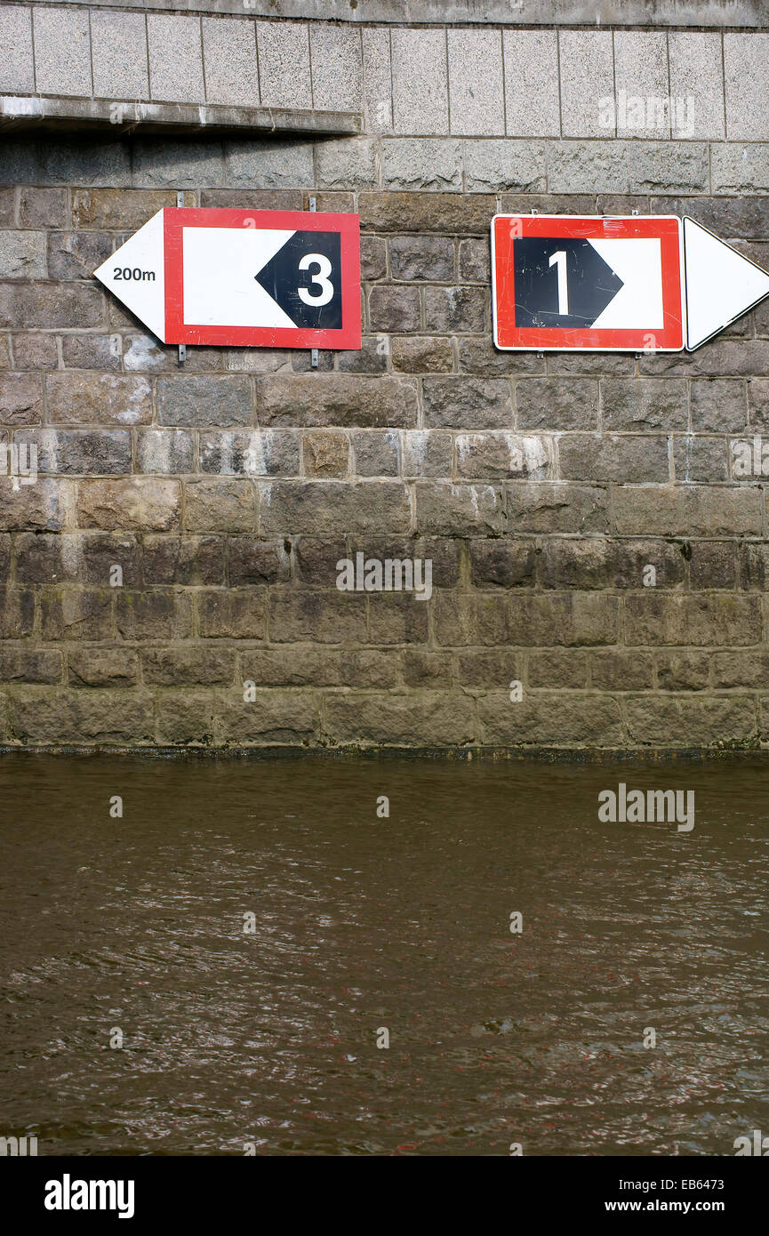 Striking Wall with arrow sign Stock Photo - Alamy