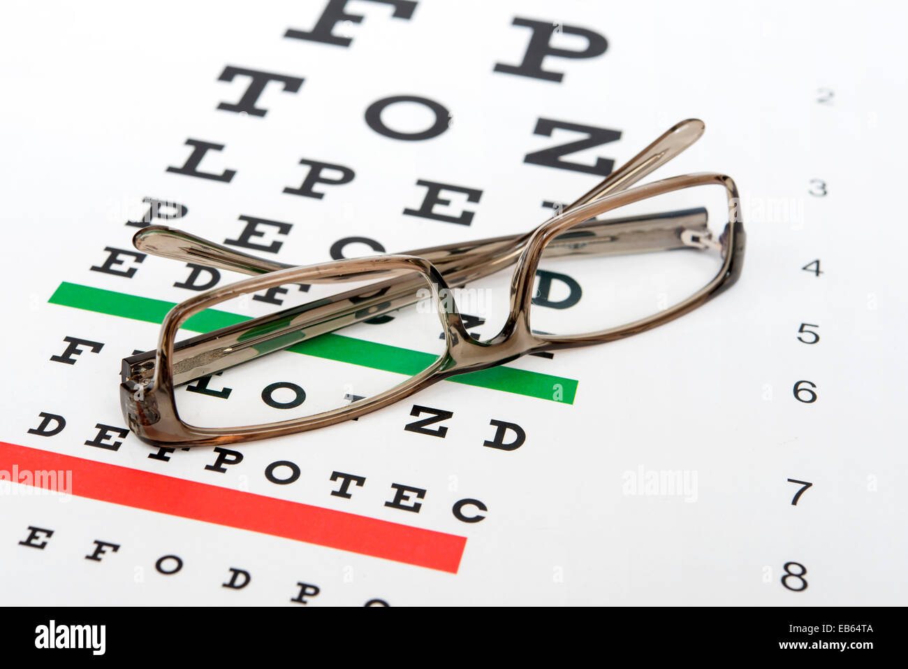 Eyeglasses on the eye chart background Stock Photo - Alamy