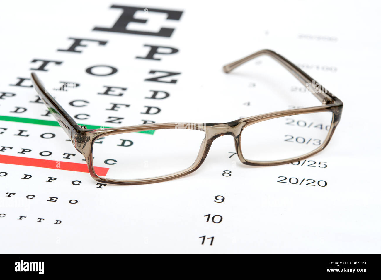 Eyeglasses on the eye chart background Stock Photo - Alamy