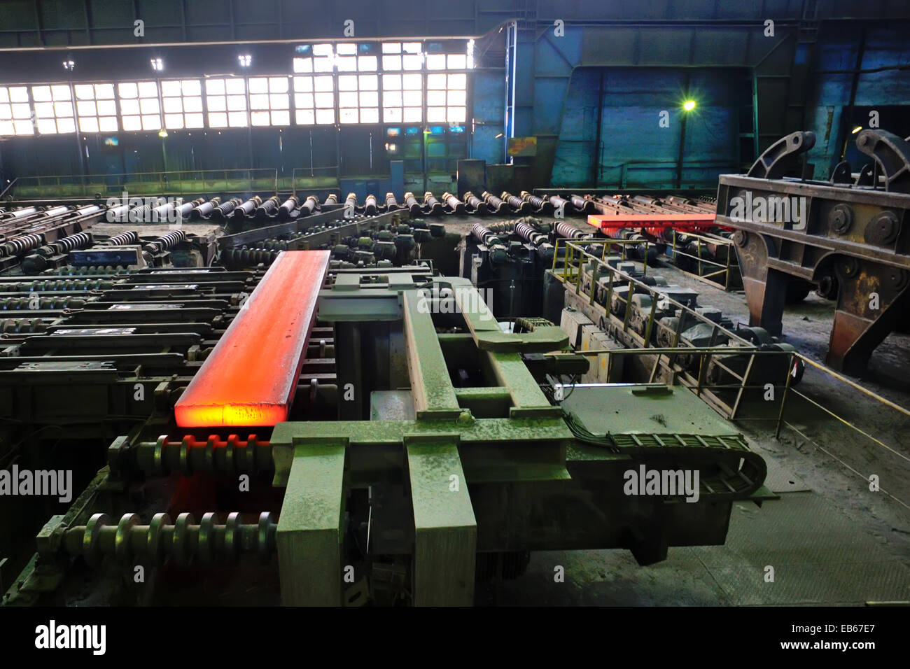 hot steel plate on conveyor inside of steel plant Stock Photo - Alamy