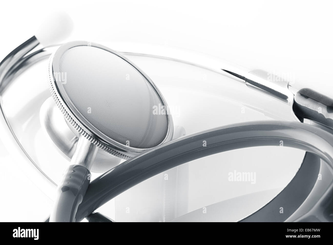 Close up view of grey stethoscope on white back Stock Photo - Alamy