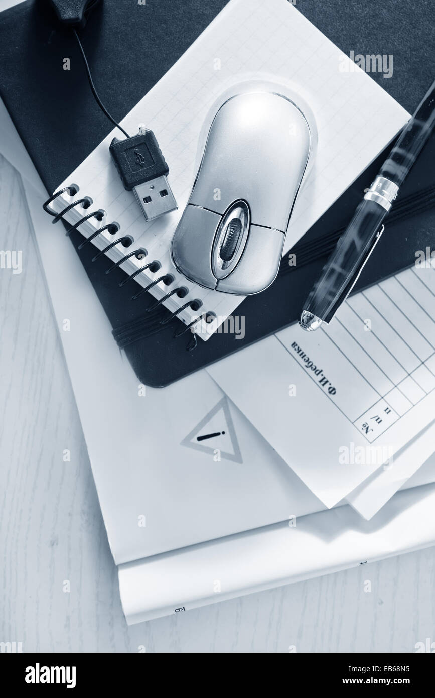 computer mouse and notebooks on a table Stock Photo - Alamy