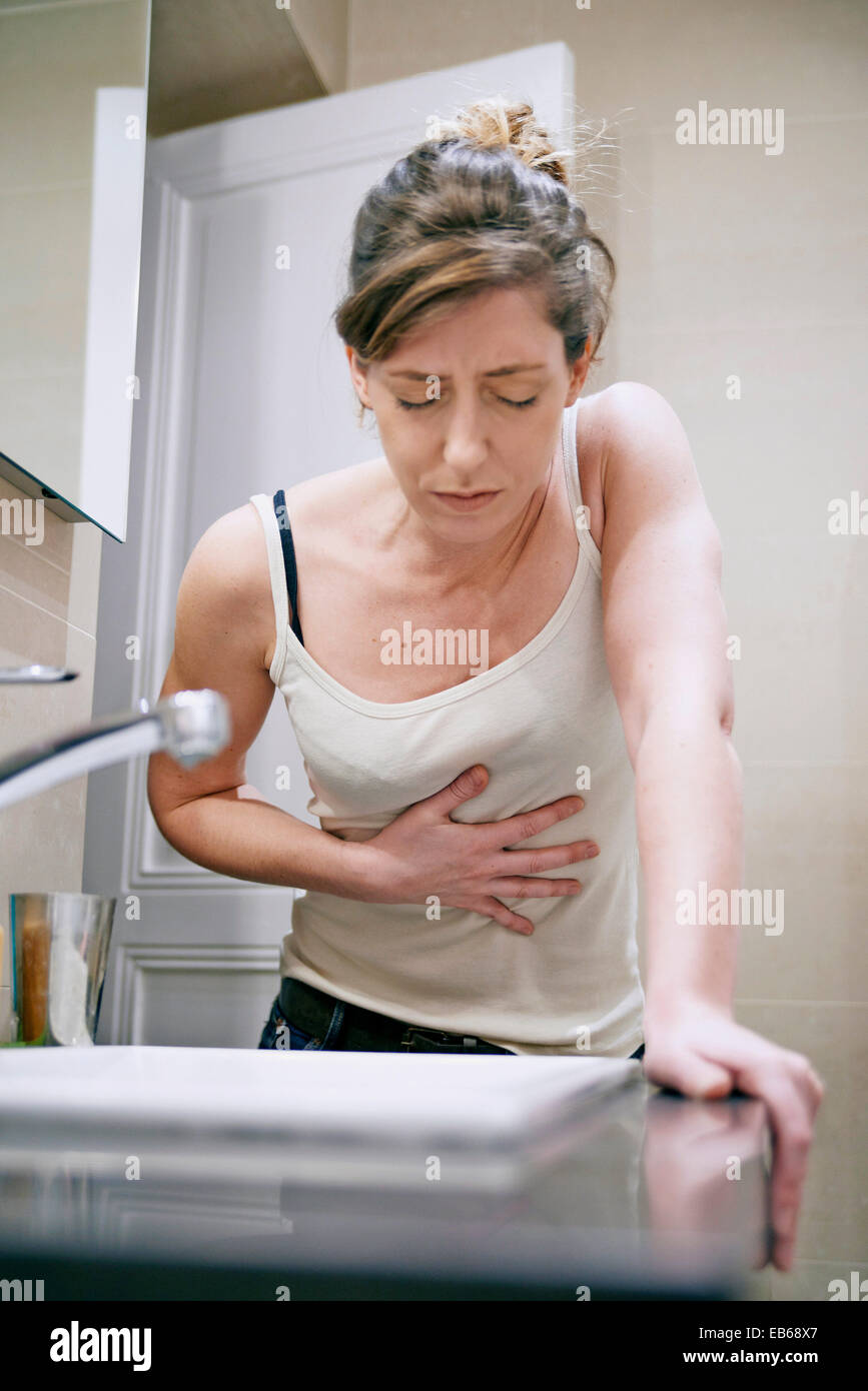 WOMAN FEELING NAUSEOUS Stock Photo - Alamy