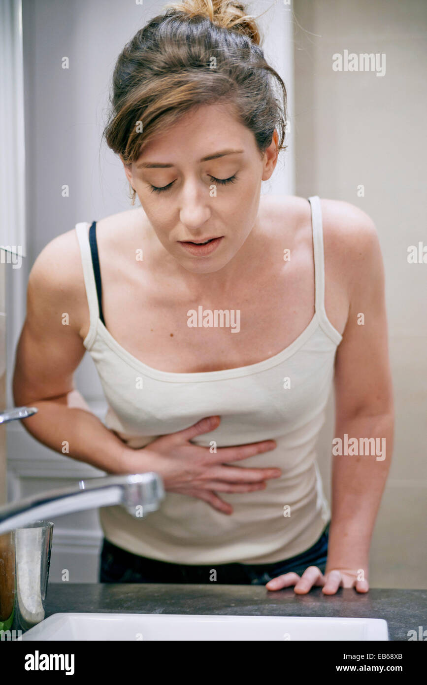 WOMAN FEELING NAUSEOUS Stock Photo - Alamy