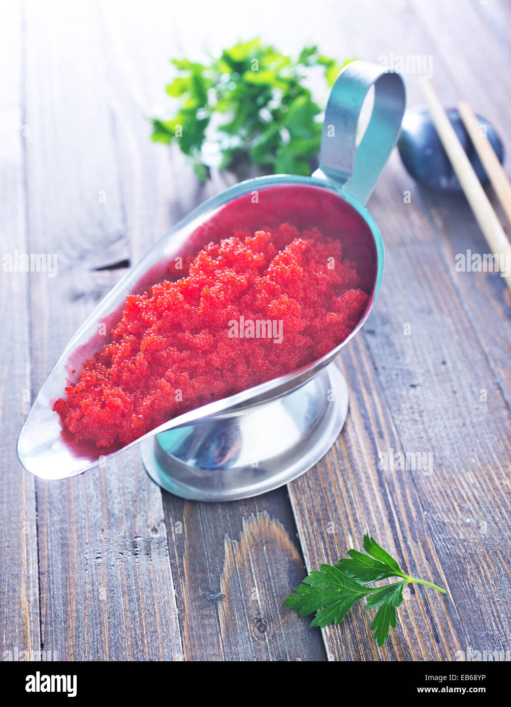 flying fish ROE, red caviar in metal bowl Stock Photo - Alamy