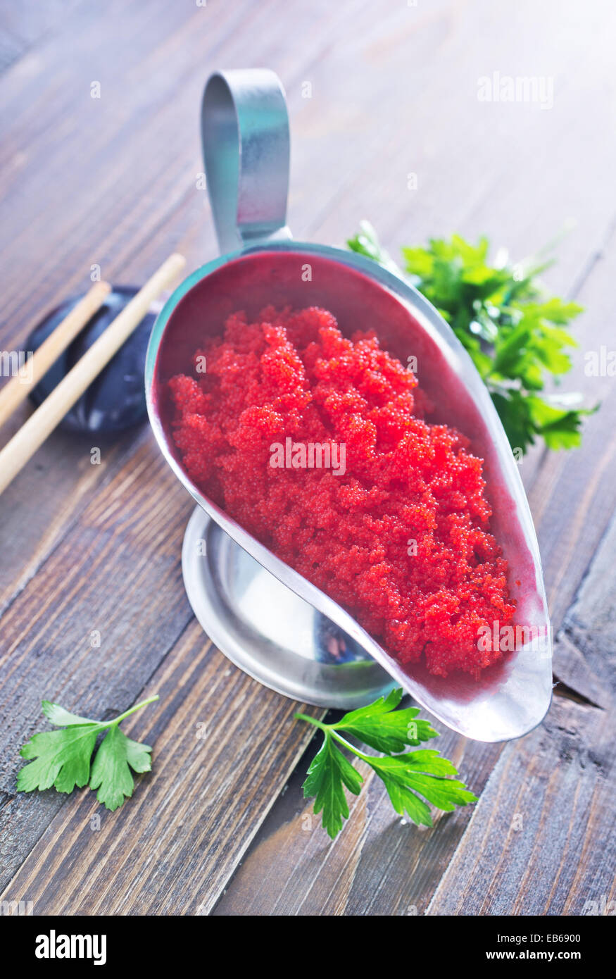 flying fish ROE, red caviar in metal bowl Stock Photo - Alamy