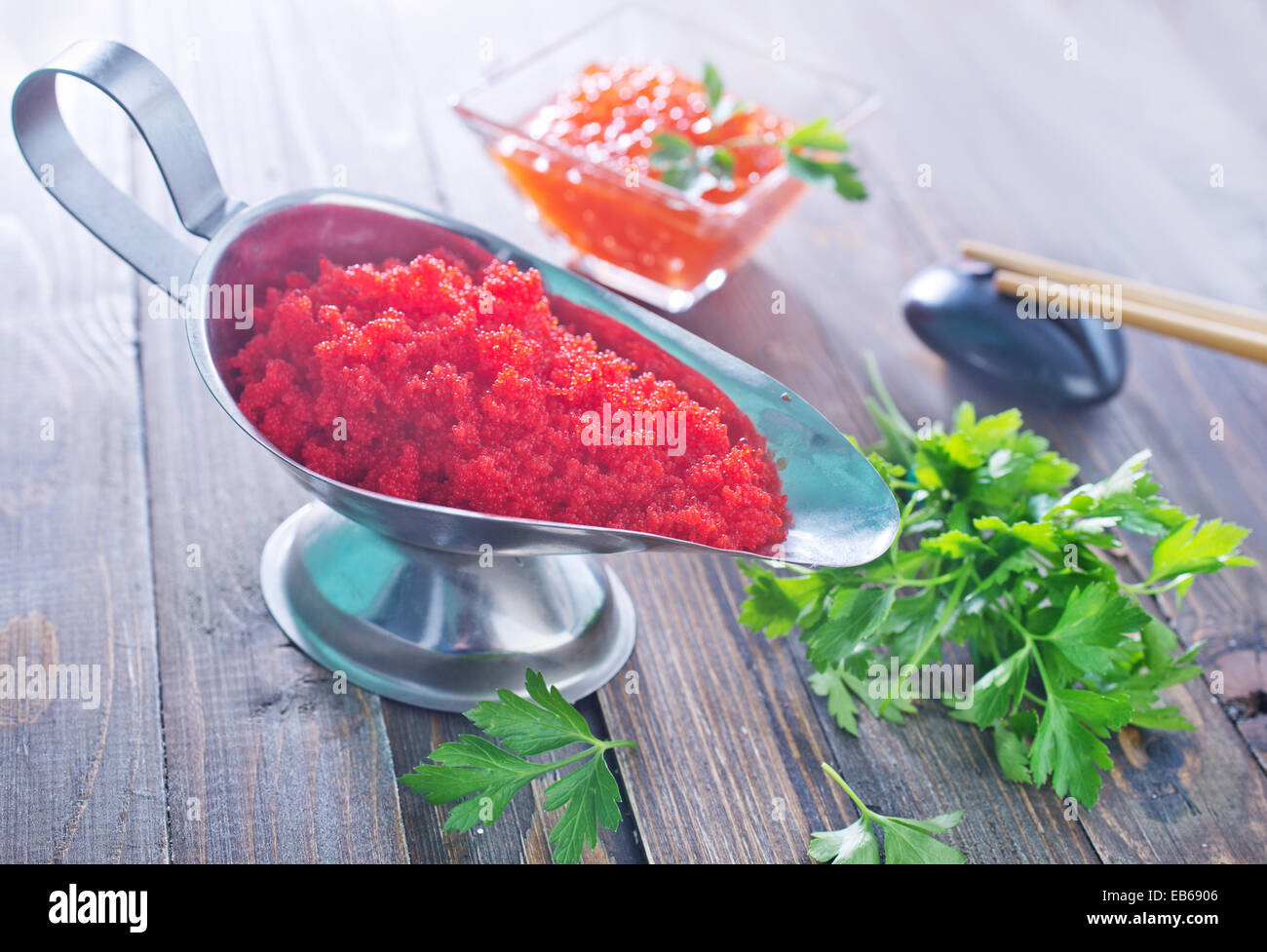 flying fish ROE, red caviar in metal bowl Stock Photo - Alamy