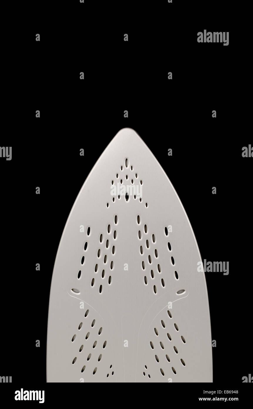 Holes on the bottom of an iron Stock Photo - Alamy