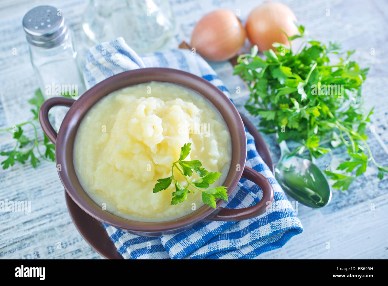 mashed potato in the bowl and on a table Stock Photo - Alamy