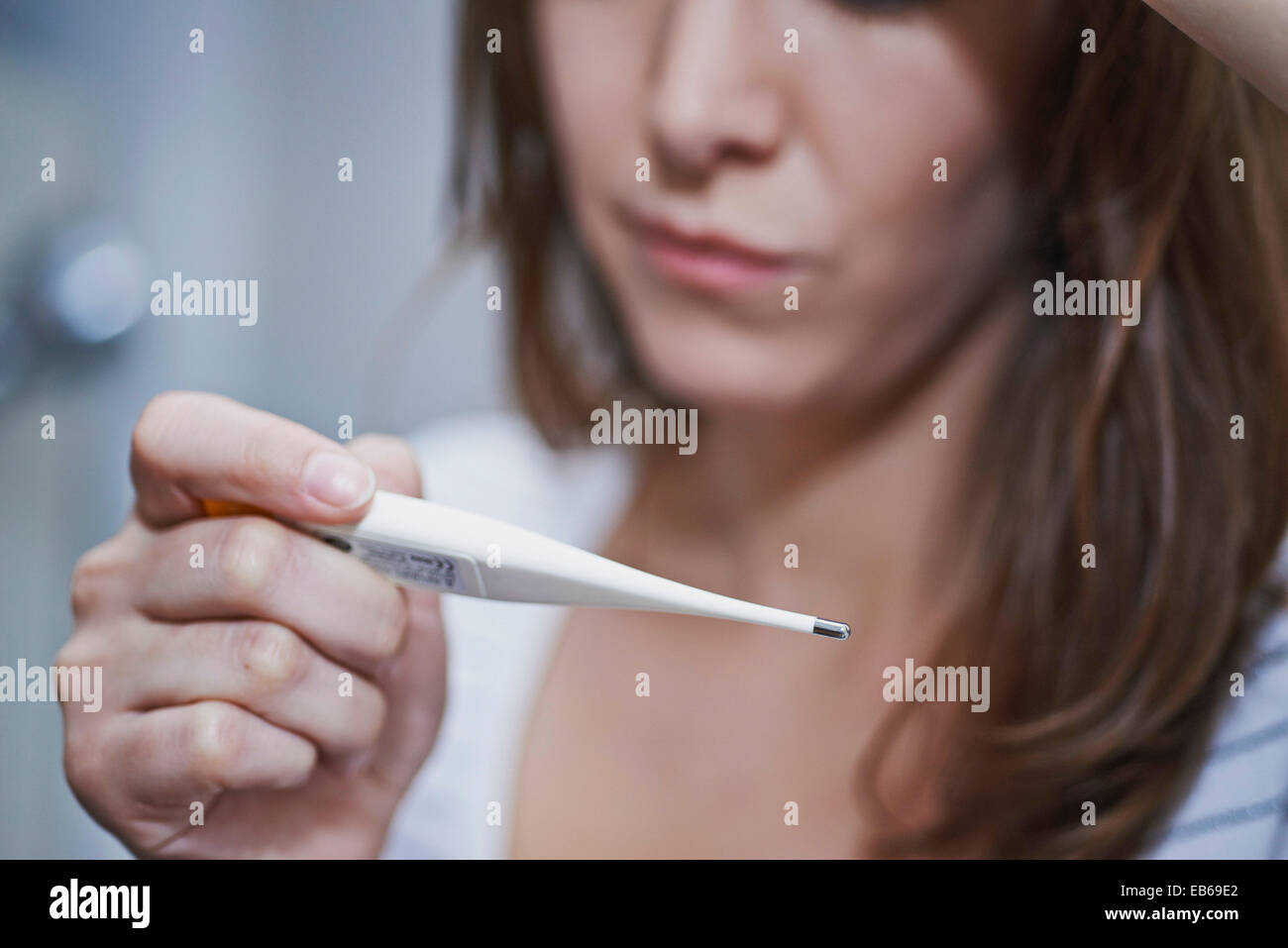 WOMAN WITH FEVER Stock Photo - Alamy