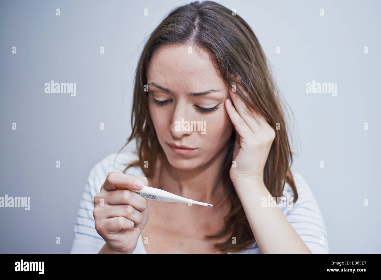 WOMAN WITH FEVER Stock Photo - Alamy