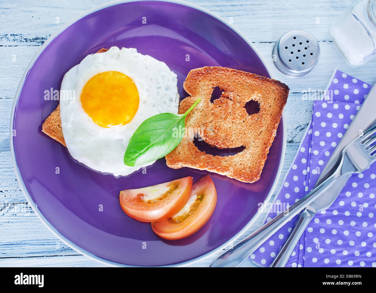 breakfast on plate, fried eggs and toasts Stock Photo - Alamy