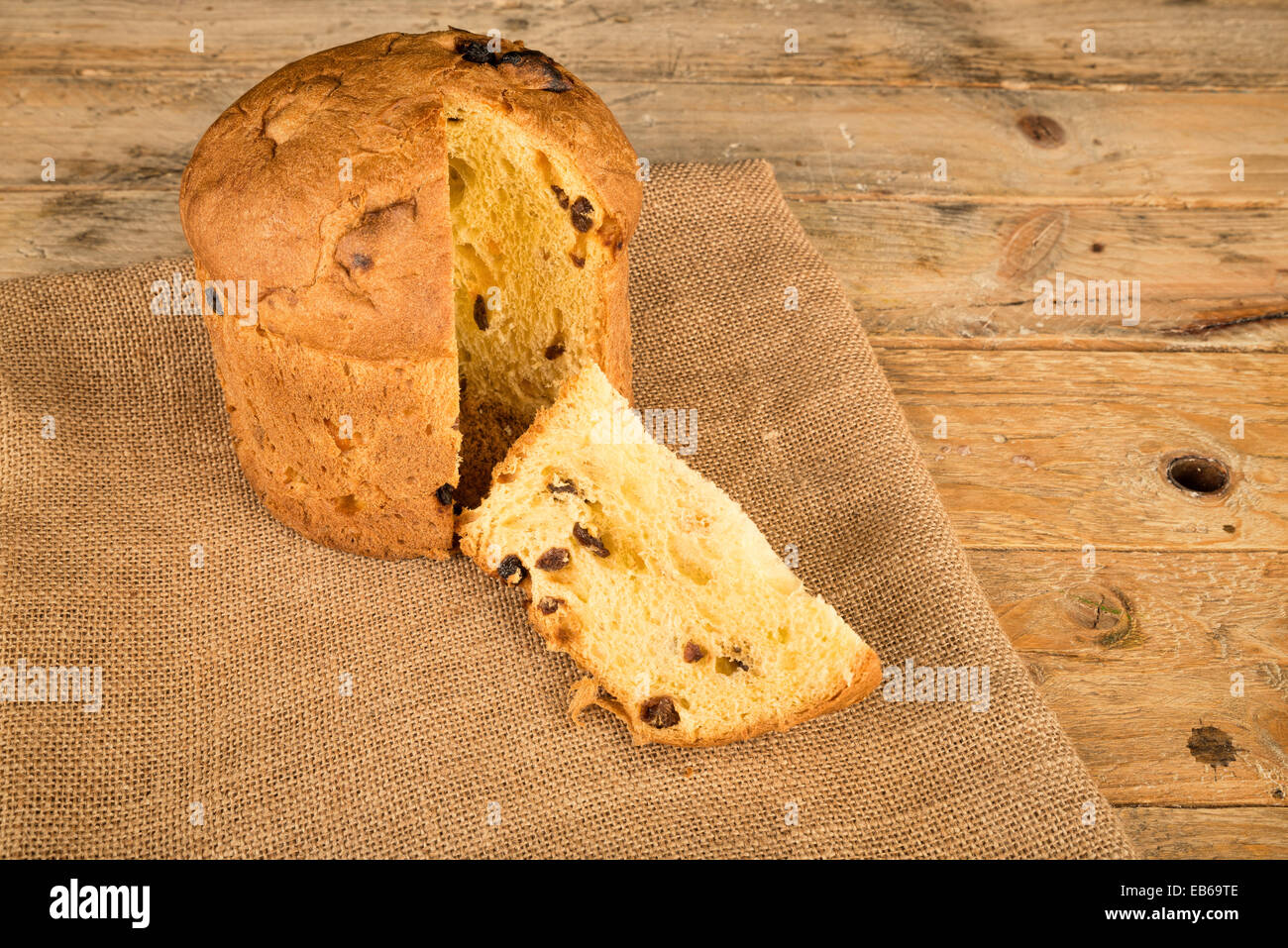 Traditional Italian panettone on a rustic wooden background Stock Photo ...