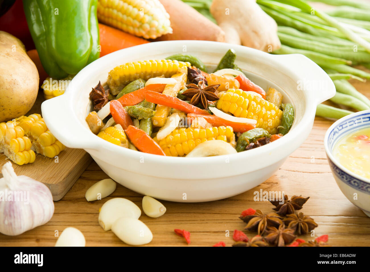 Assorted vegetables and cooked vegetable dish Stock Photo - Alamy