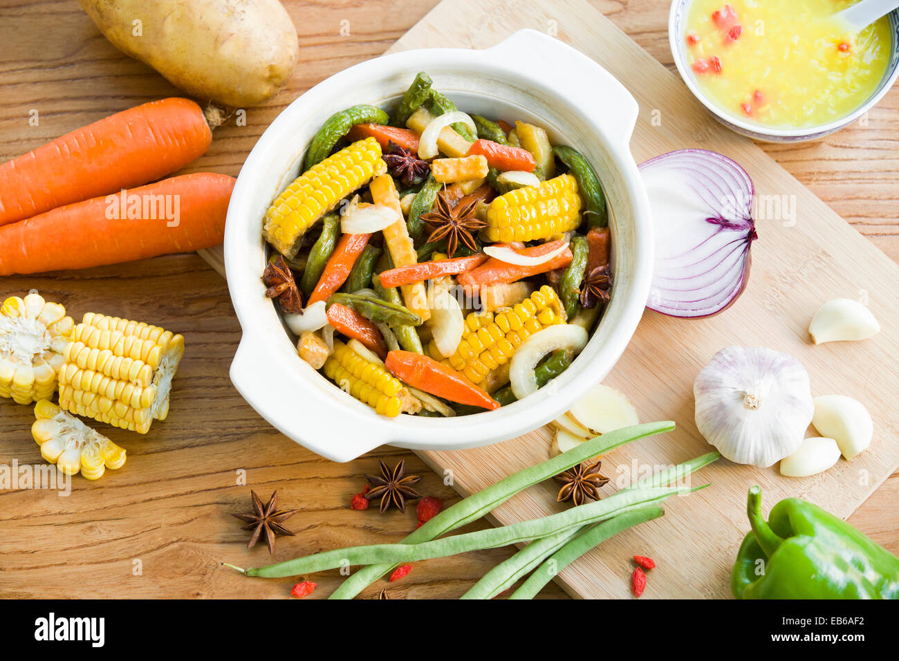 Assorted vegetables and cooked vegetable dish Stock Photo - Alamy