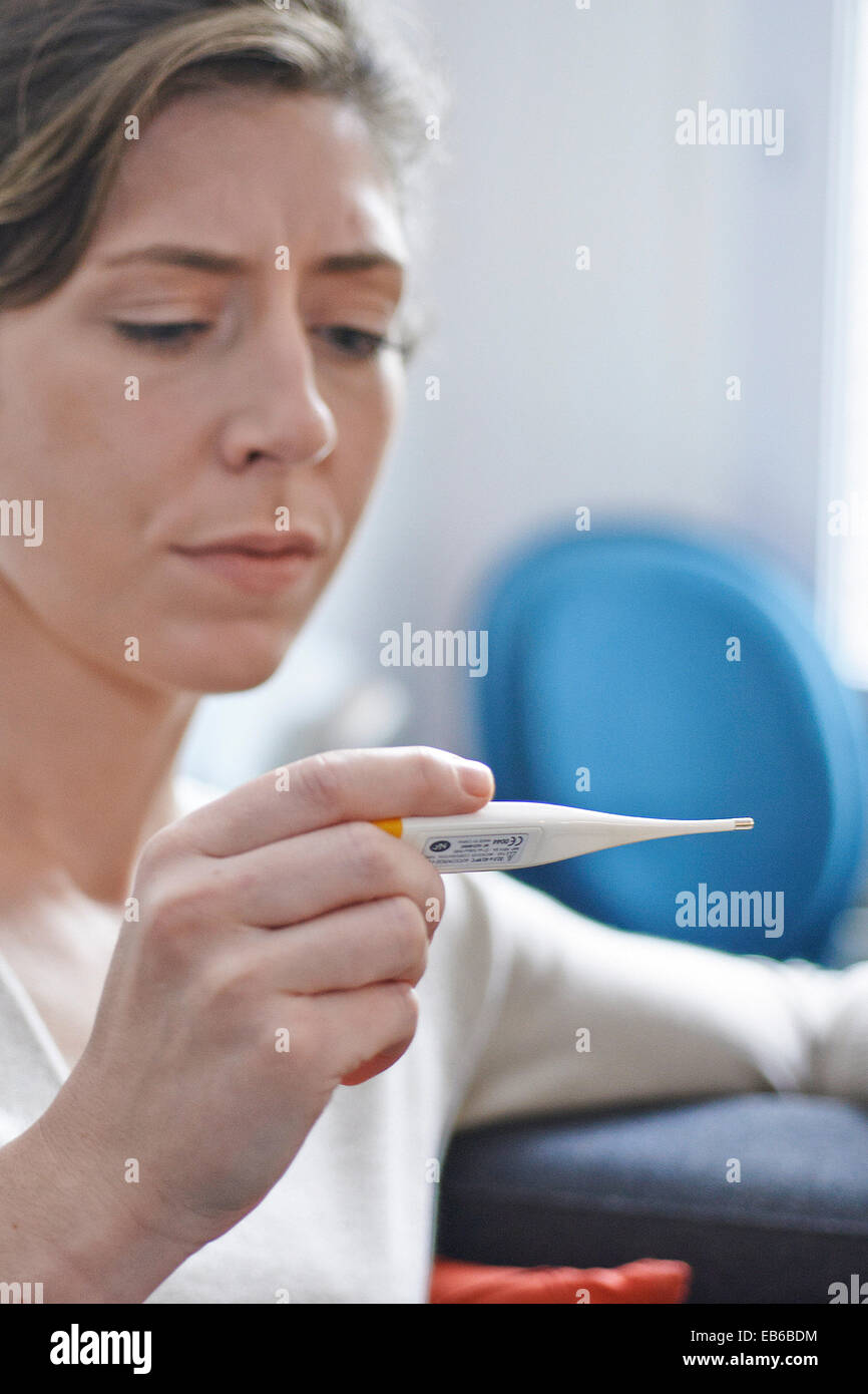 WOMAN WITH FEVER Stock Photo - Alamy