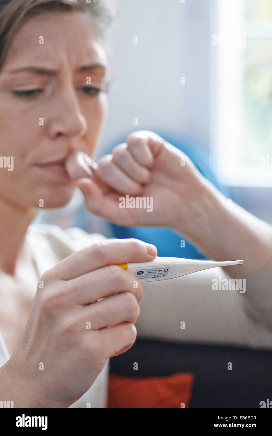 WOMAN WITH FEVER Stock Photo - Alamy