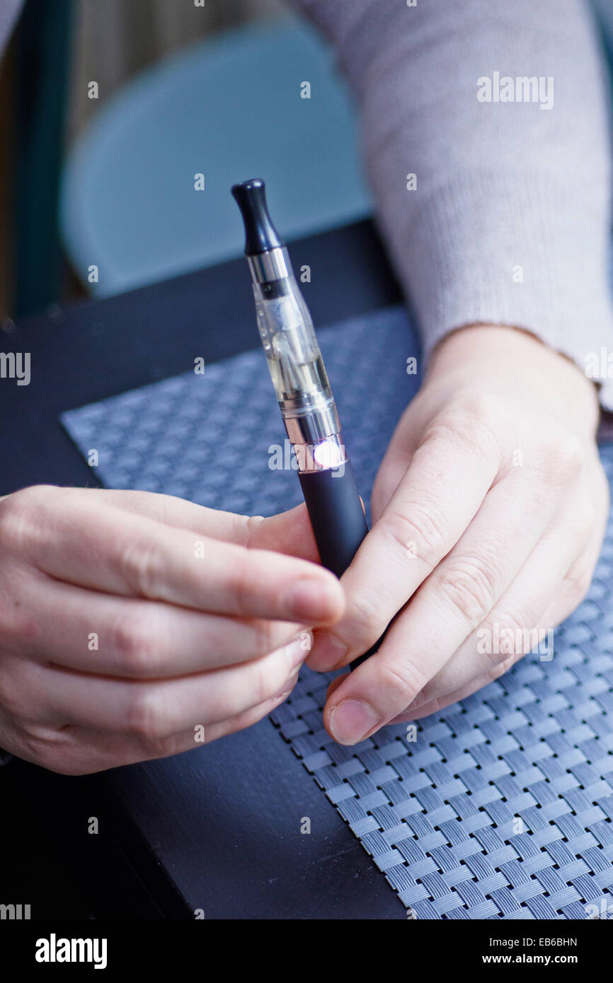 Women smoking electronic cigarettes hi-res stock photography and images ...