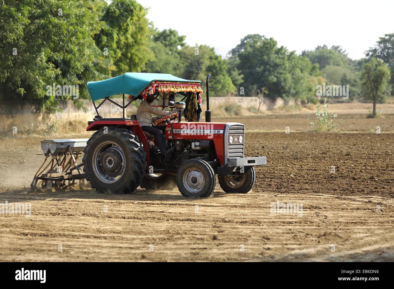 Tractor plowing a field Rajasthan India Stock Photo - Alamy