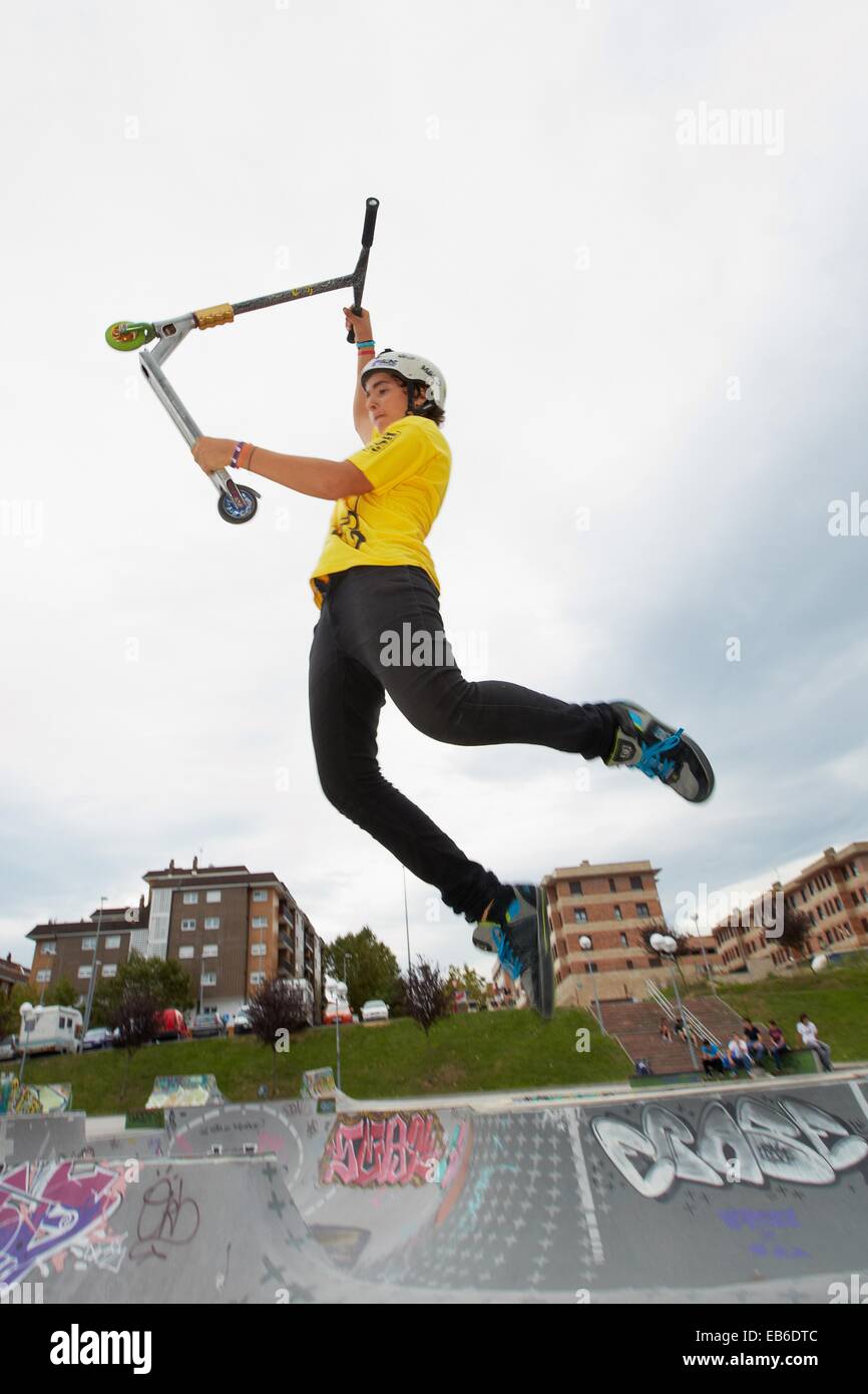 Teenager with city scooter in Skate park, Leioa, Bizkaia, Basque ...