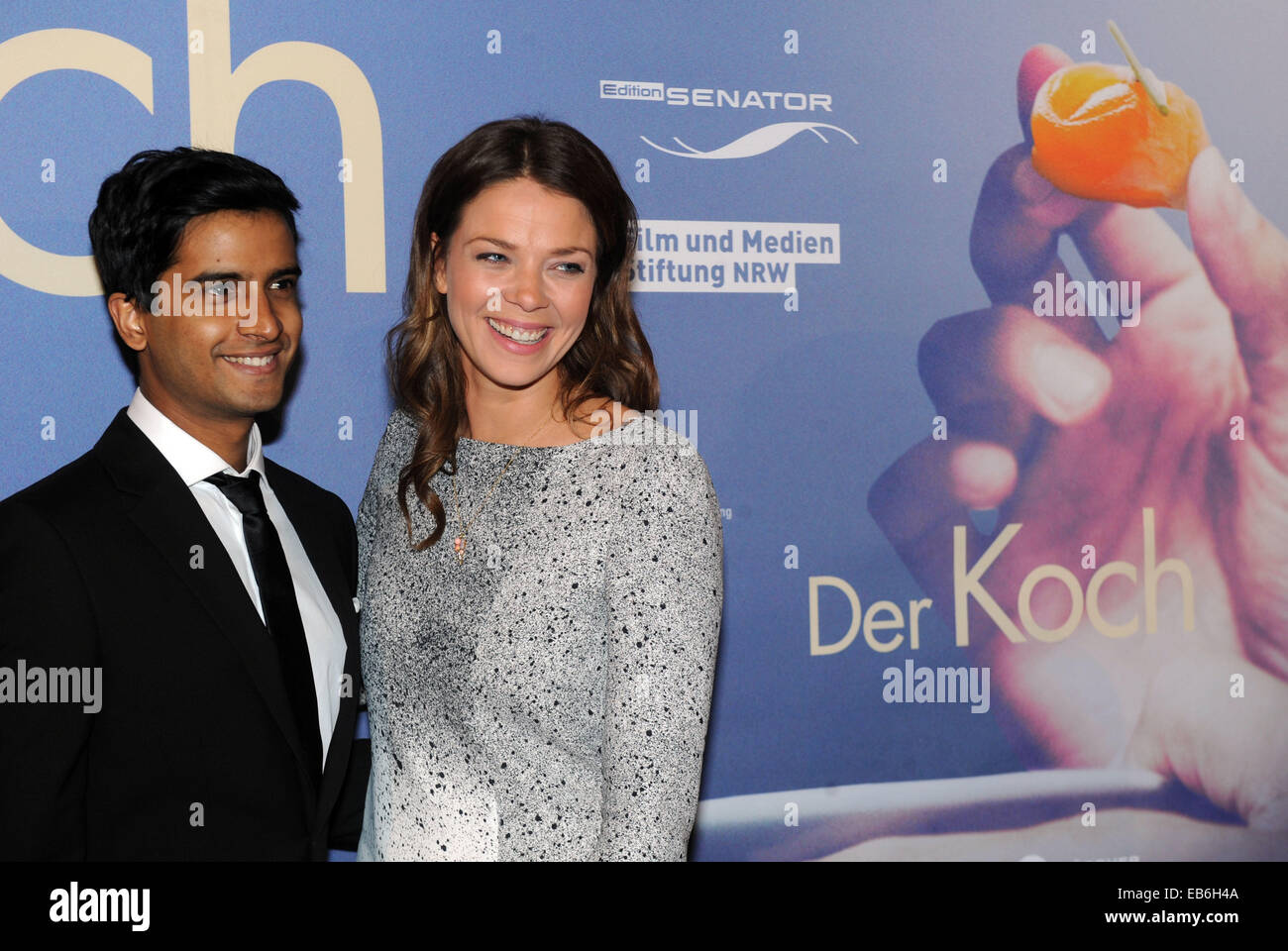 Essen, Germany. 26th Nov, 2014. Actress Jessica Schwarz and Hamza Jeetooa arrive to the premier ...
