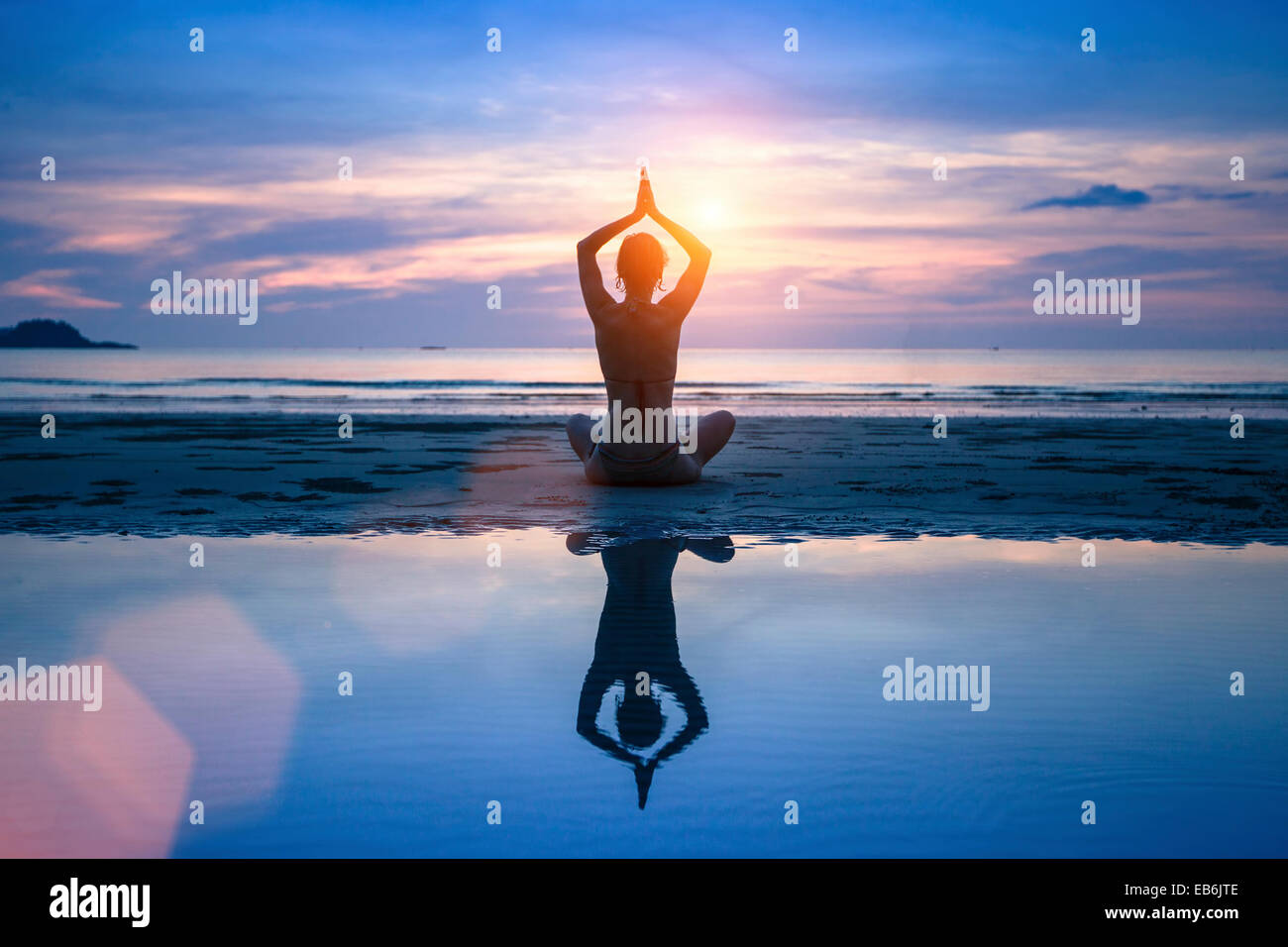 Yoga on the sea beach, meditation Stock Photo - Alamy
