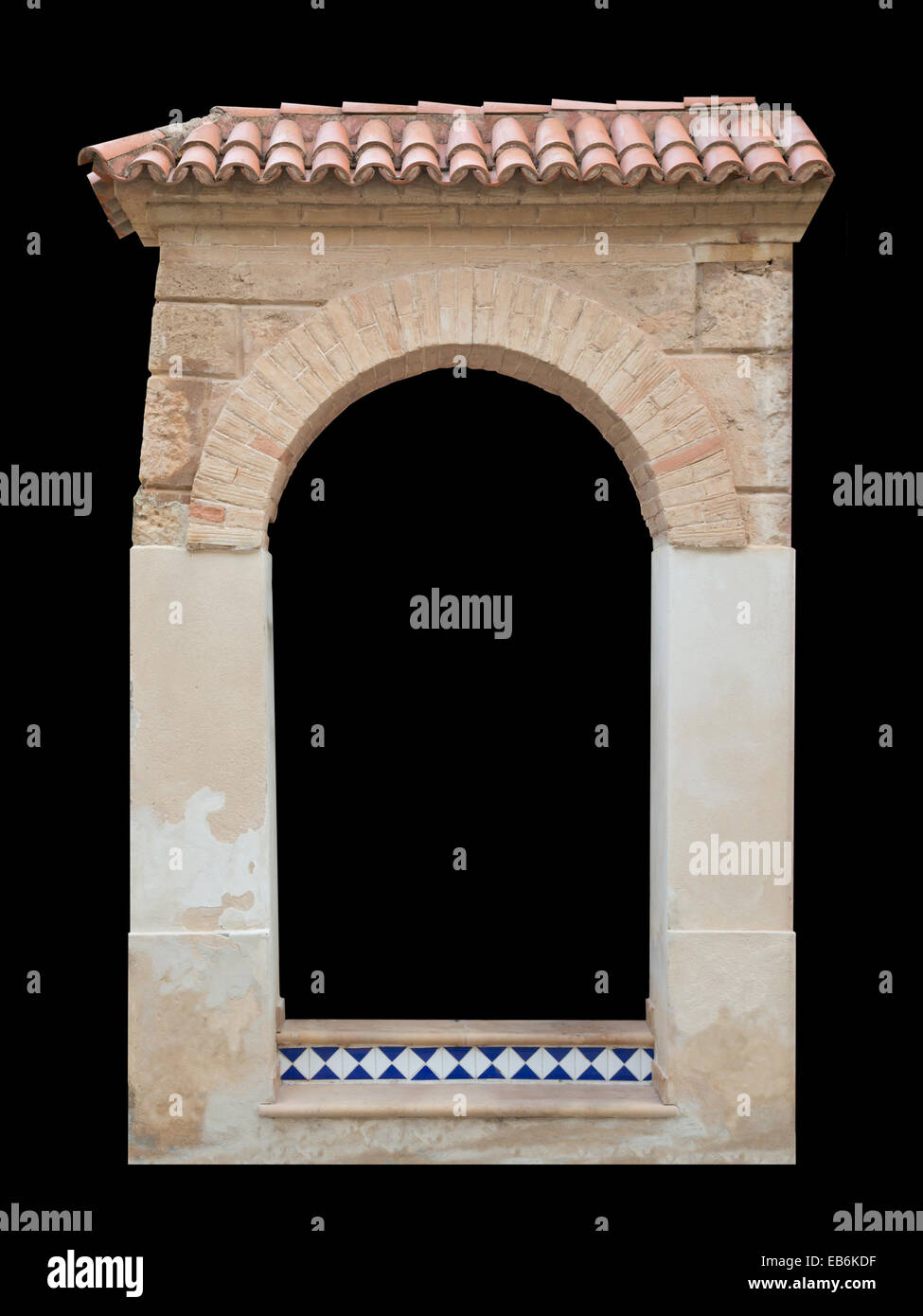 Entrance portal. Entrance portal in building of stone with tiled roof ...