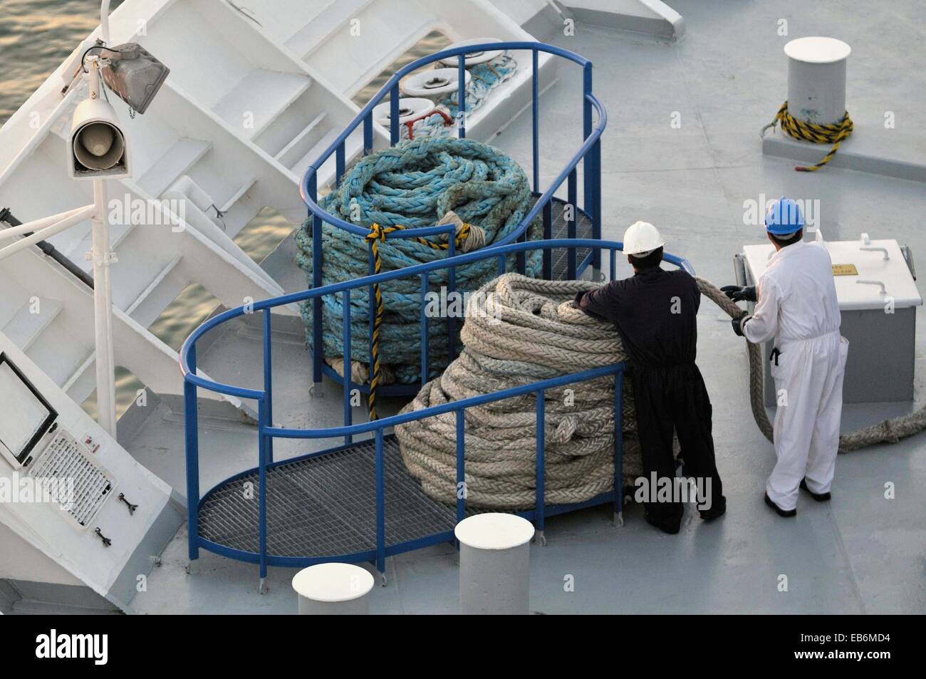 Cruise ship. Sailors working Stock Photo - Alamy