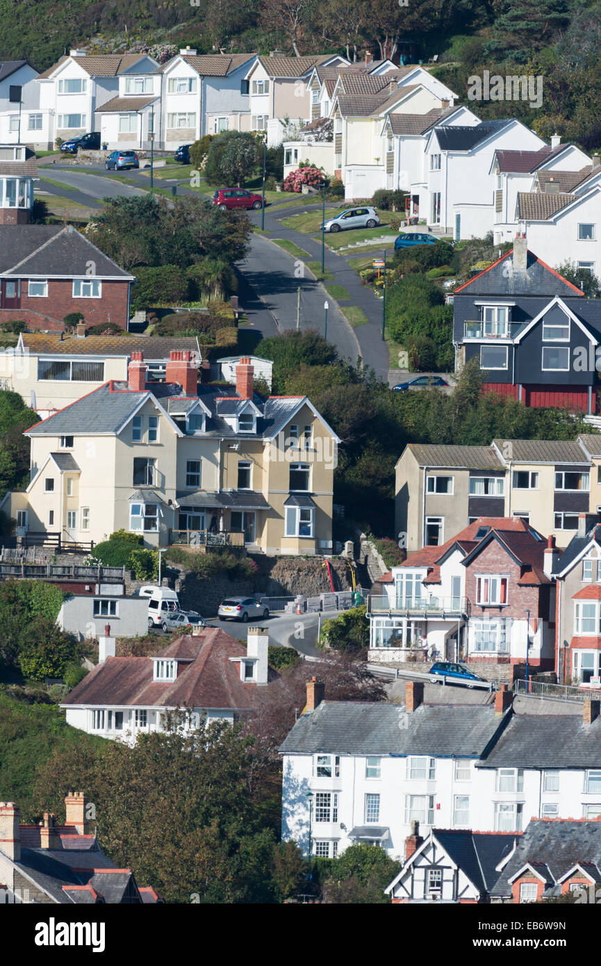 Rows of terraced, semi detached and detached houses and rooftops ...