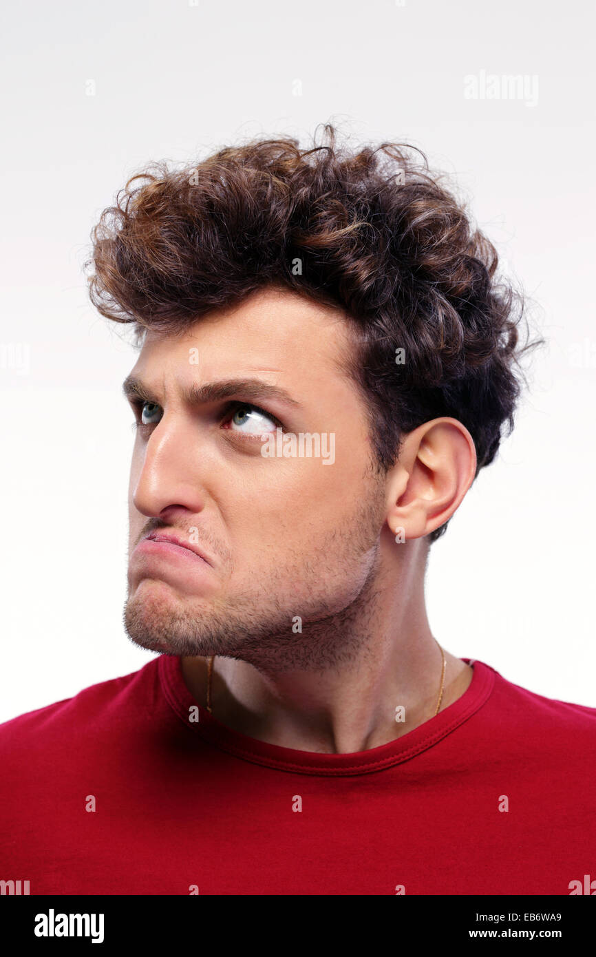 Closeup portrait of angry man looking up over gray background Stock ...