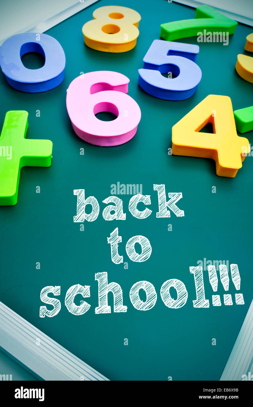 sentence back to school written in a chalkboard and numbers of ...