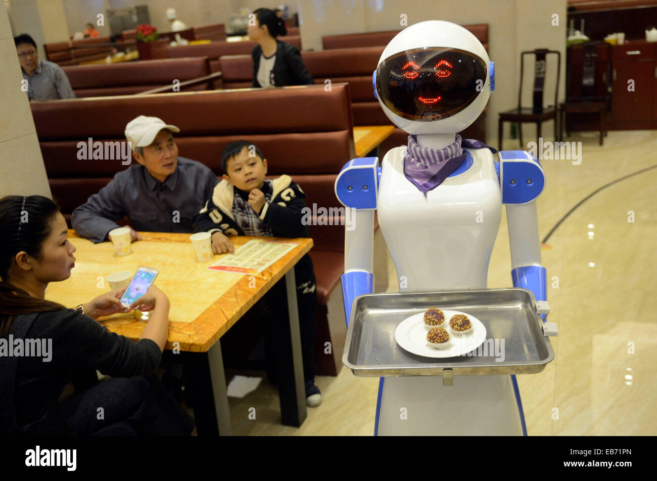 Cixi, China's Zhejiang Province. 27th Nov, 2014. A server robot ...