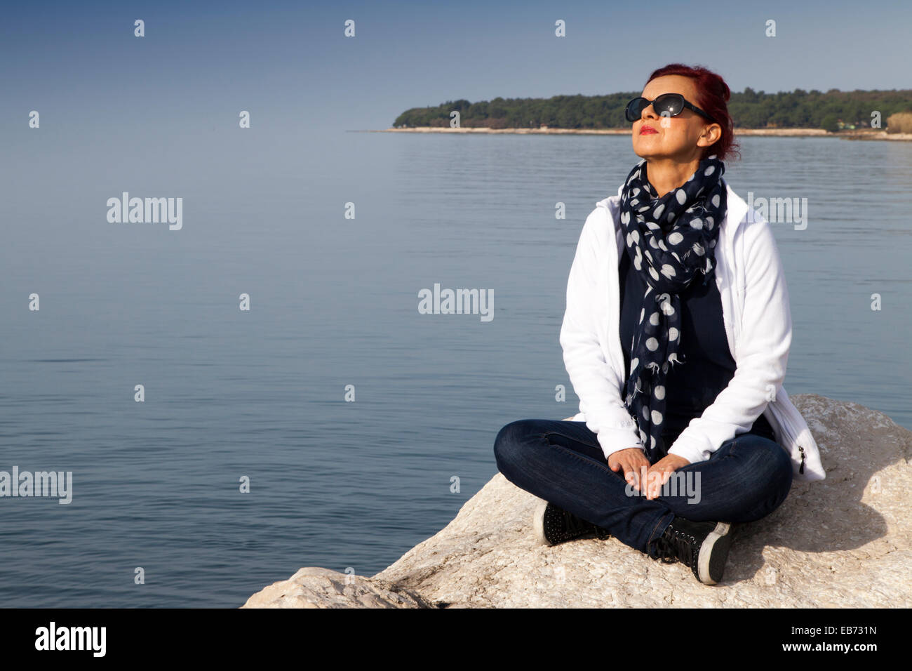 Pretty woman catching the sun Stock Photo - Alamy