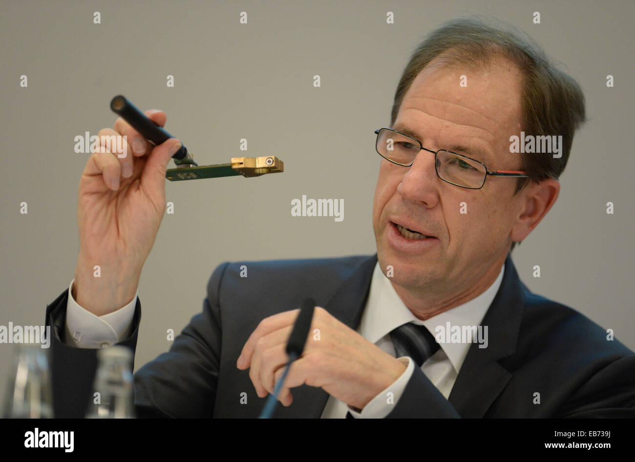Munich, Germany. 27th Nov, 2014. Infineon CEO Reinhard Ploss stands in ...