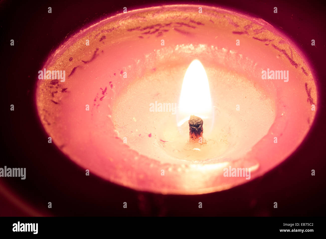 Macro view of a lit purple candle Stock Photo - Alamy