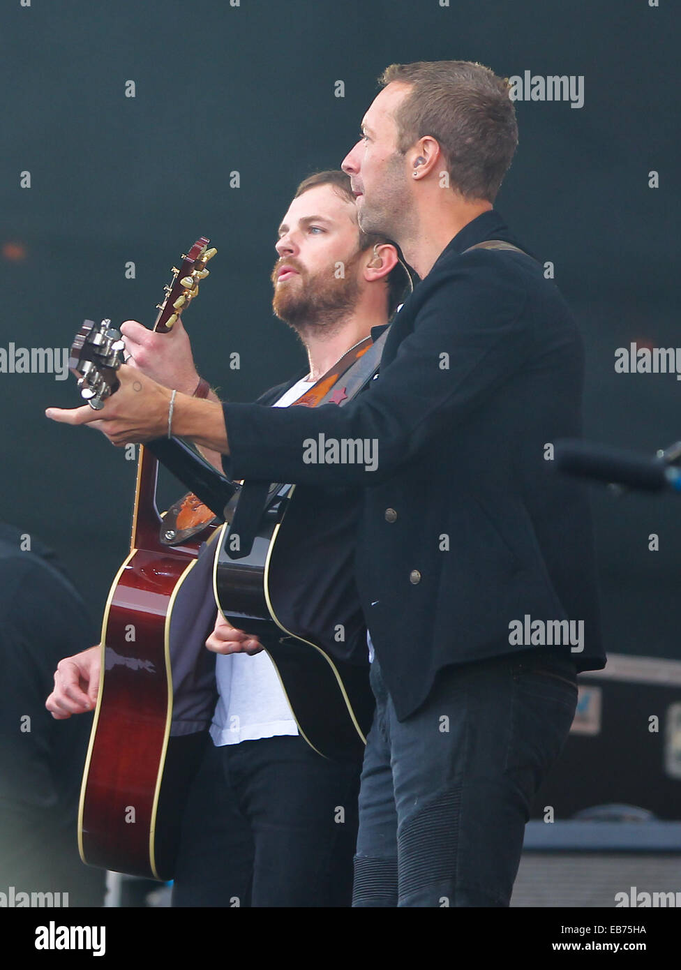 Chris Martin of Coldplay joins Kings Of Leon on stage during their set ...