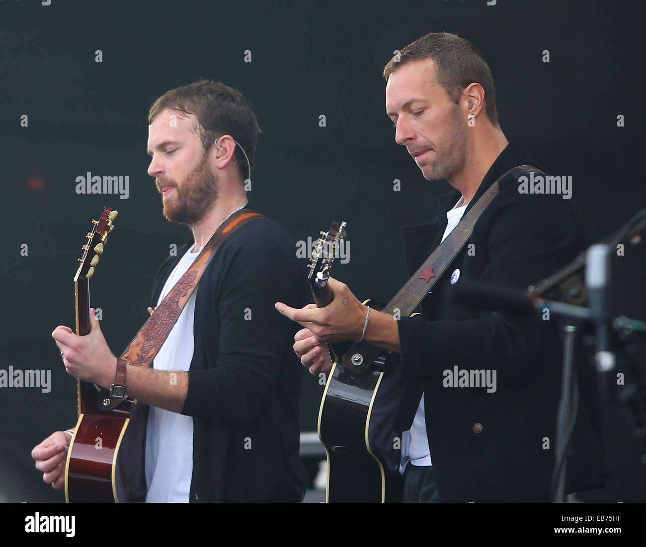 Chris Martin of Coldplay joins Kings Of Leon on stage during their set ...